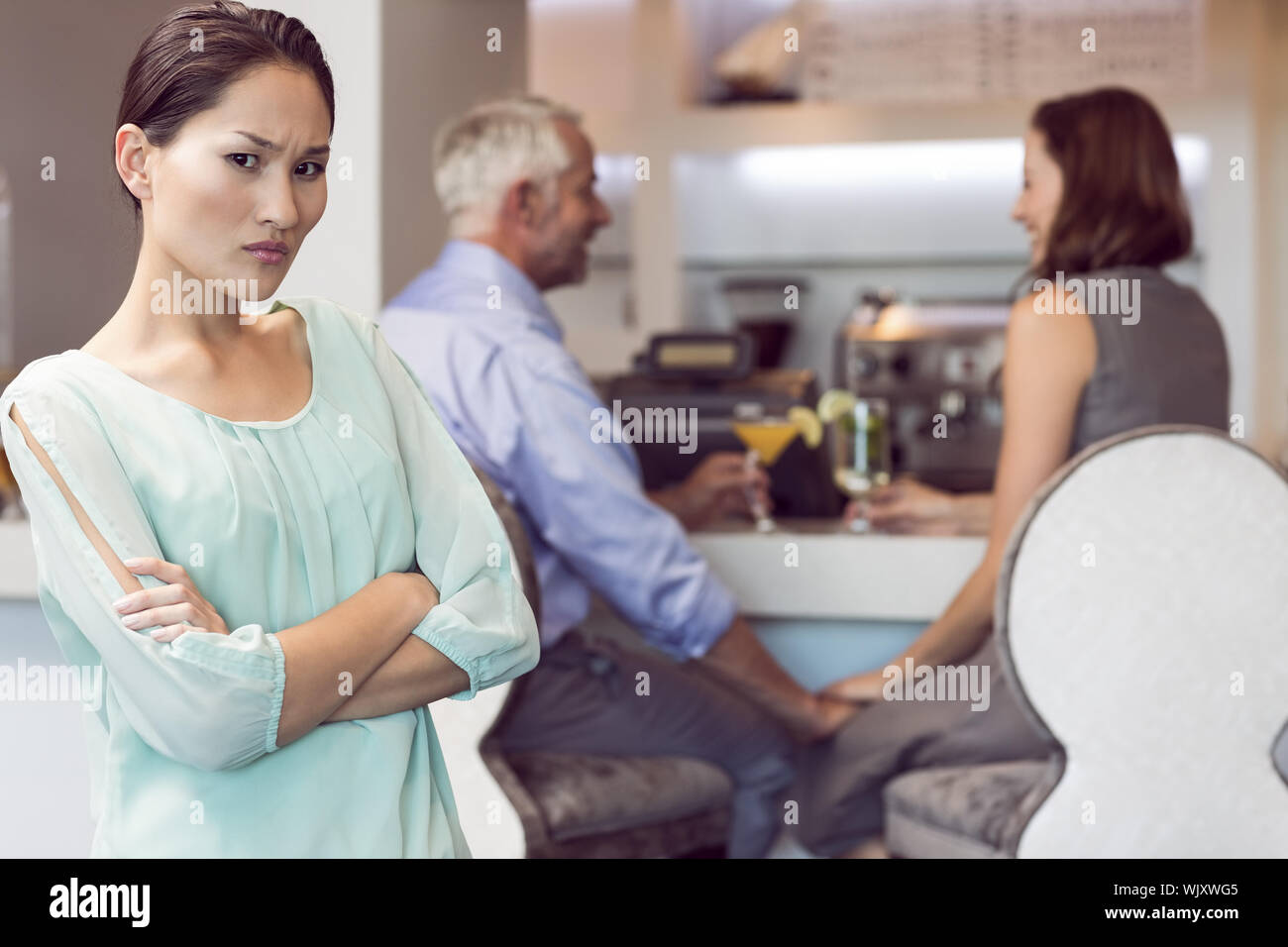 Jealous man looking at couple bar hi-res stock photography and images ...