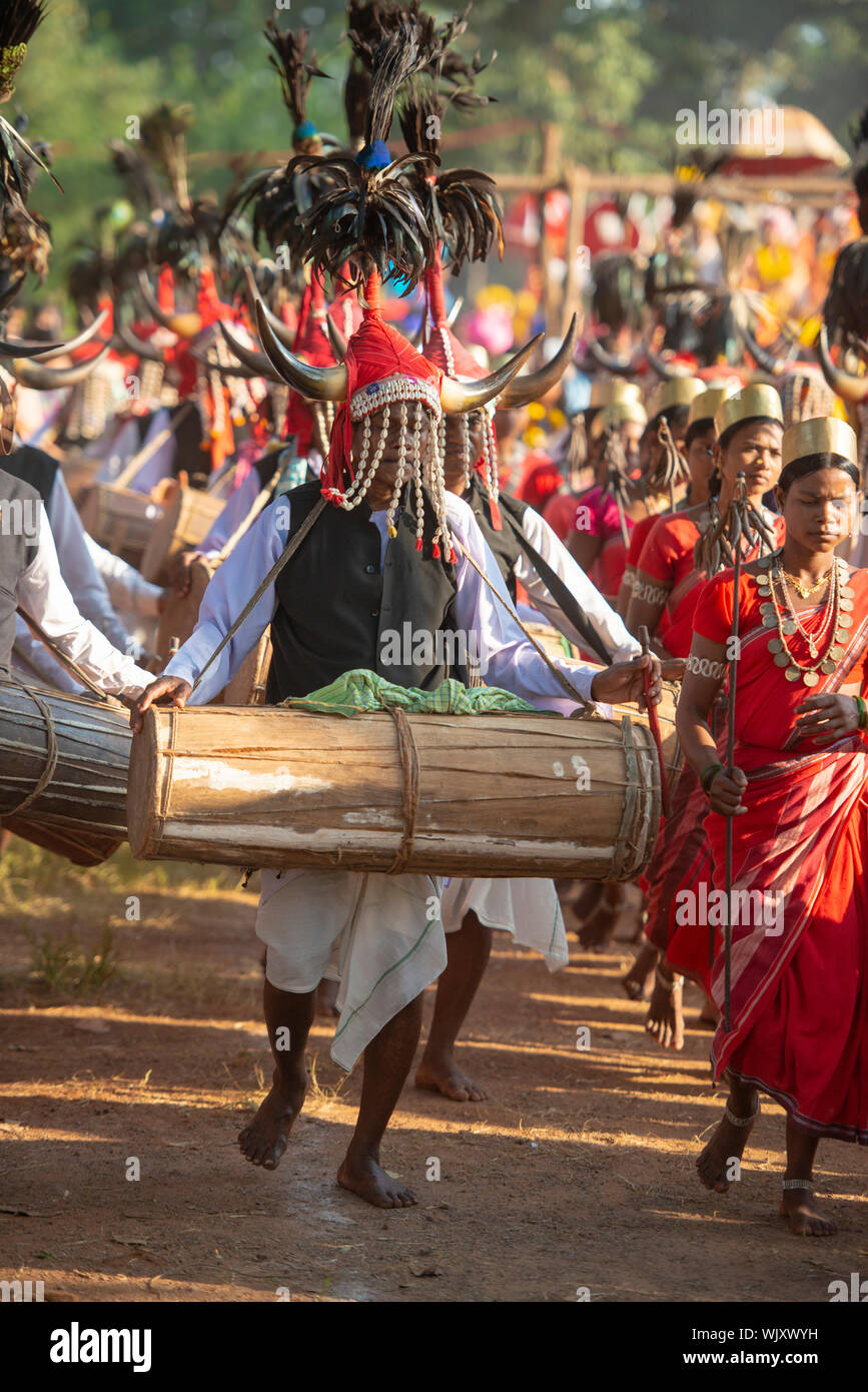 Tribal Man and woman dancing and beating dhols in traditional Attire ...
