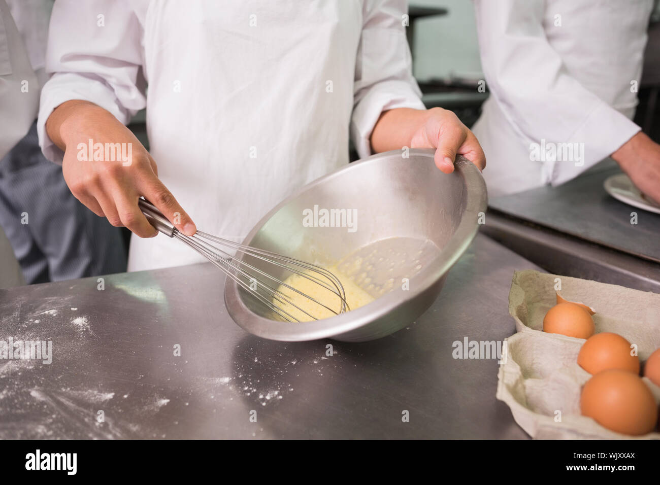 Female chef whisking eggs in hi-res stock photography and images - Alamy