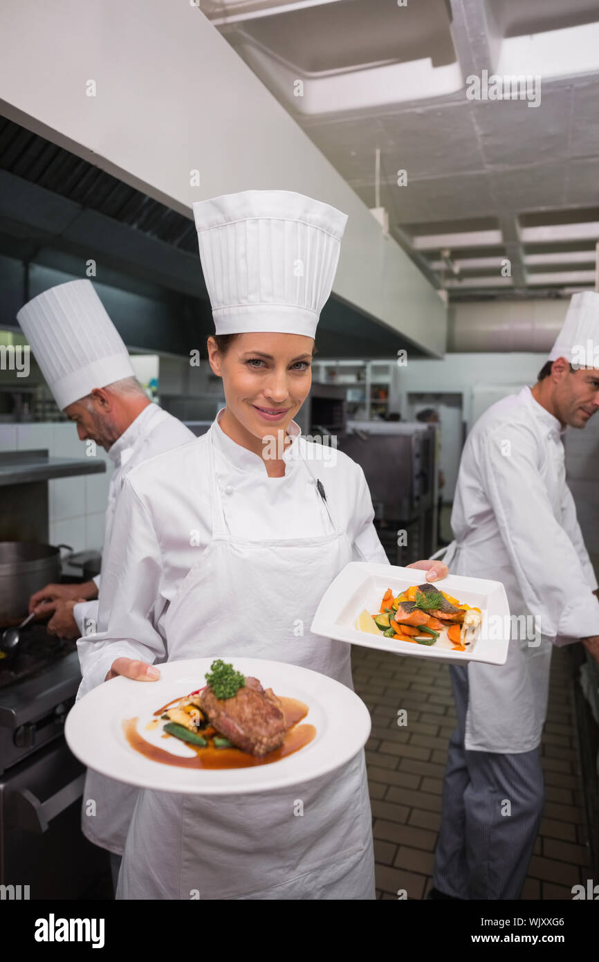 Caucasian smiling woman fish kitchen hi-res stock photography and ...