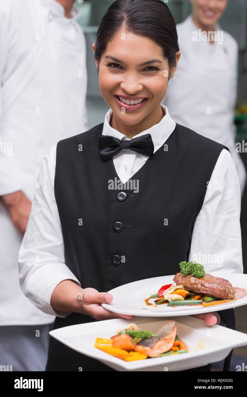 Caucasian smiling woman fish kitchen hi-res stock photography and ...