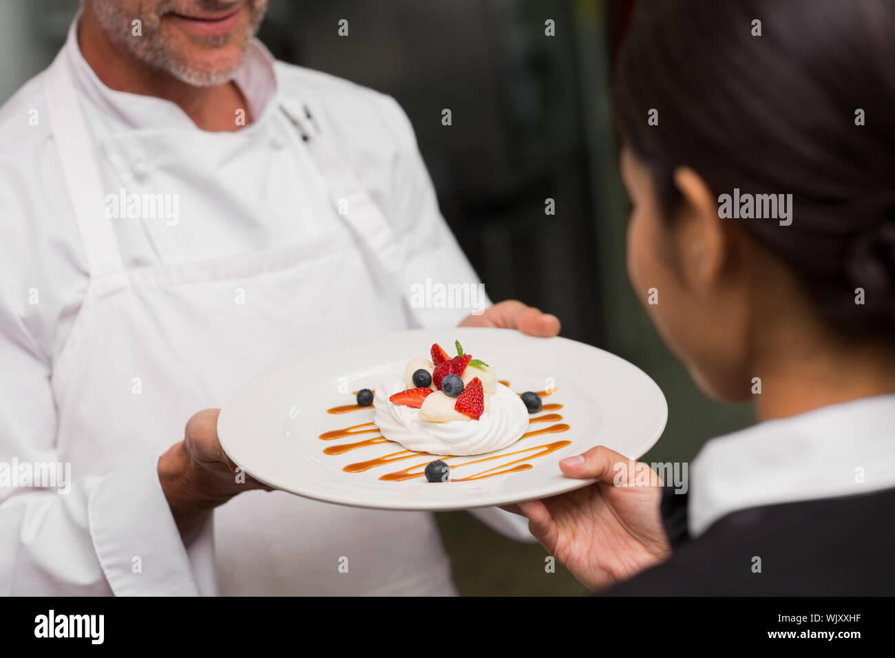 Handing dessert hi-res stock photography and images - Alamy