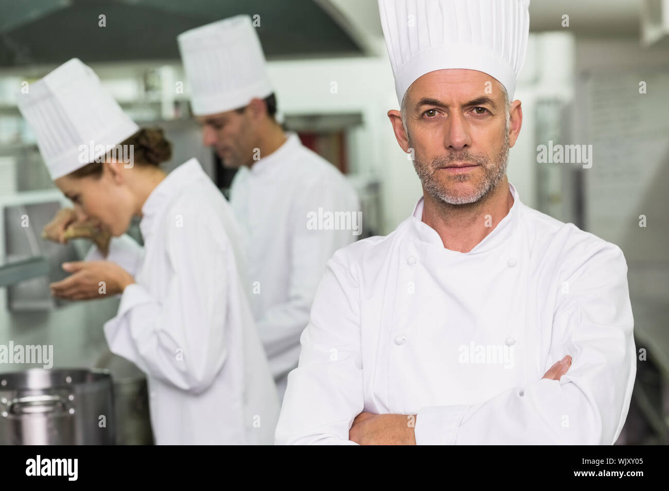 Serious woman cooking stove hi-res stock photography and images - Alamy