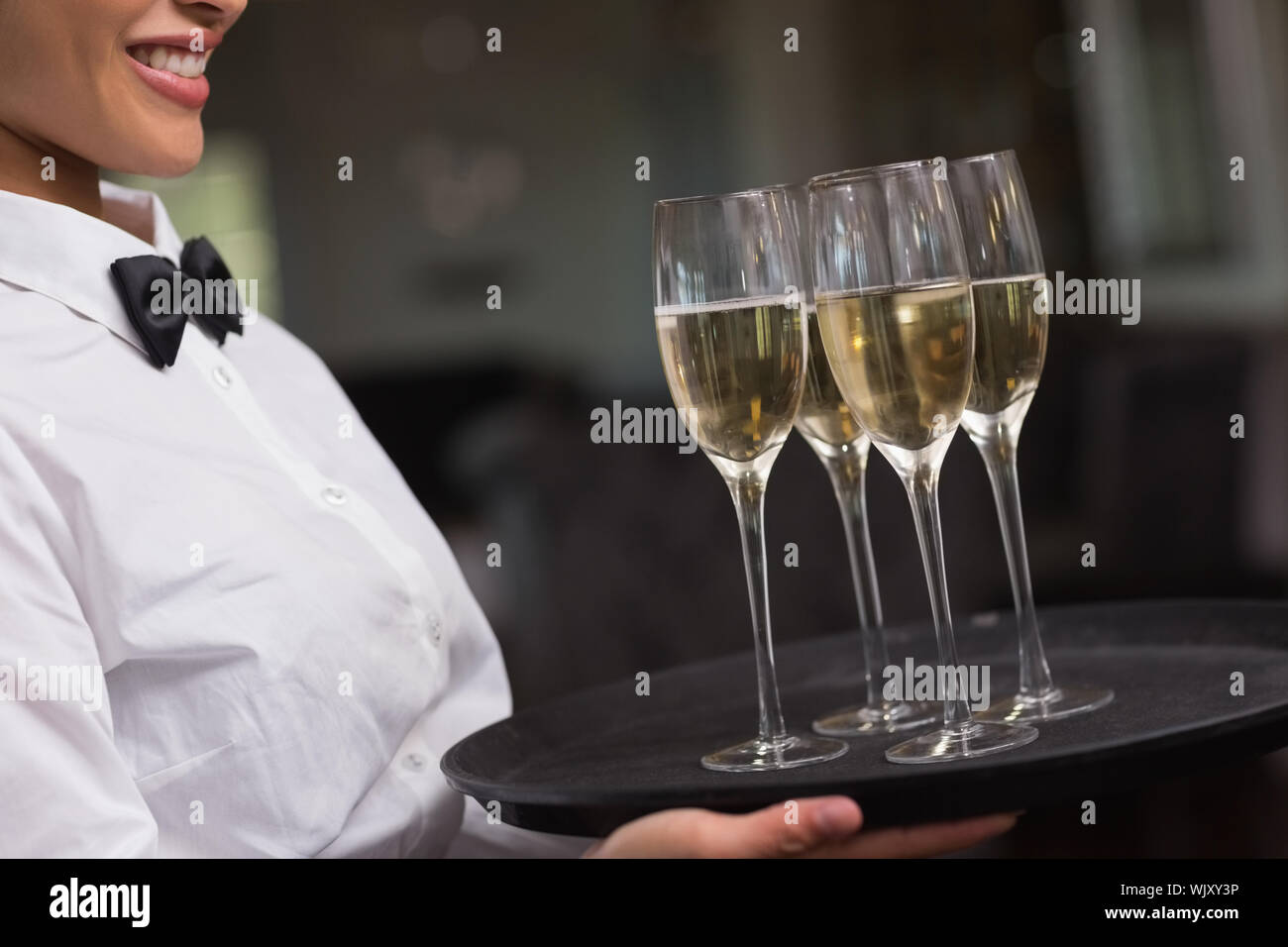 Pretty waitress holding tray hi-res stock photography and images - Alamy