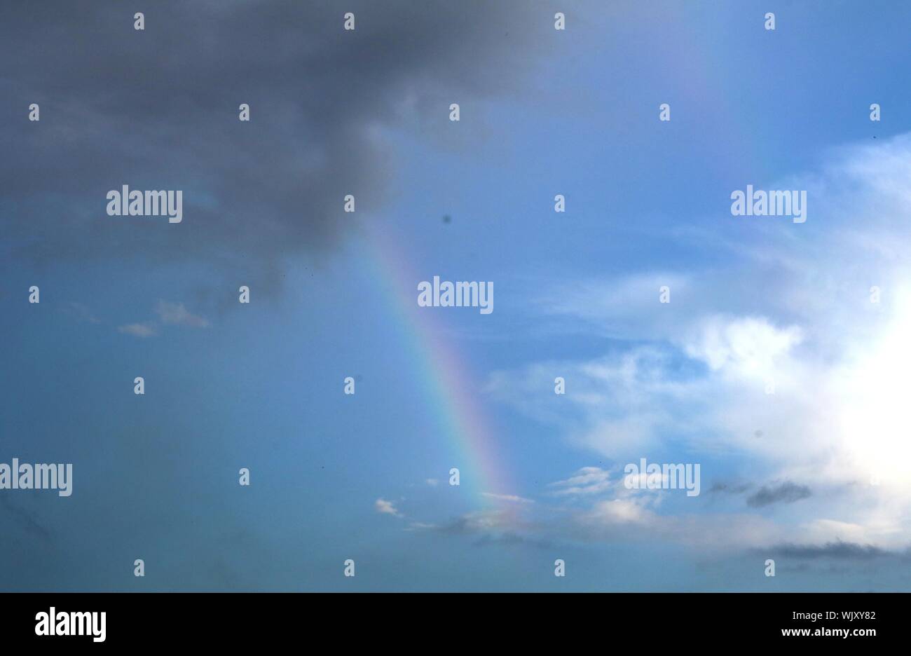 A Very Soft Rainbow Appears On The Sky, Beautiful Natural View After ...
