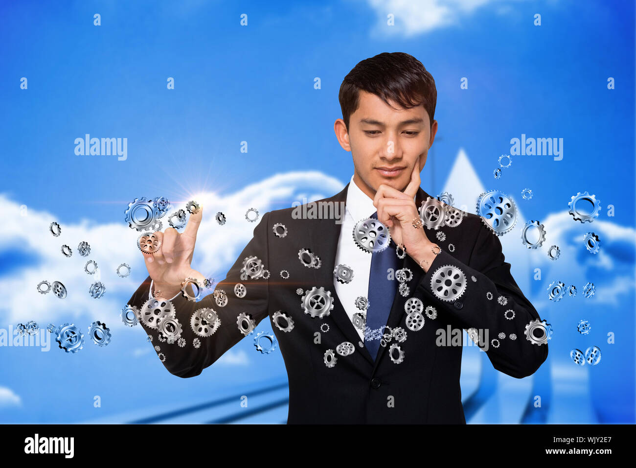 Digital composite of thinking businessman touching cogs and wheels ...
