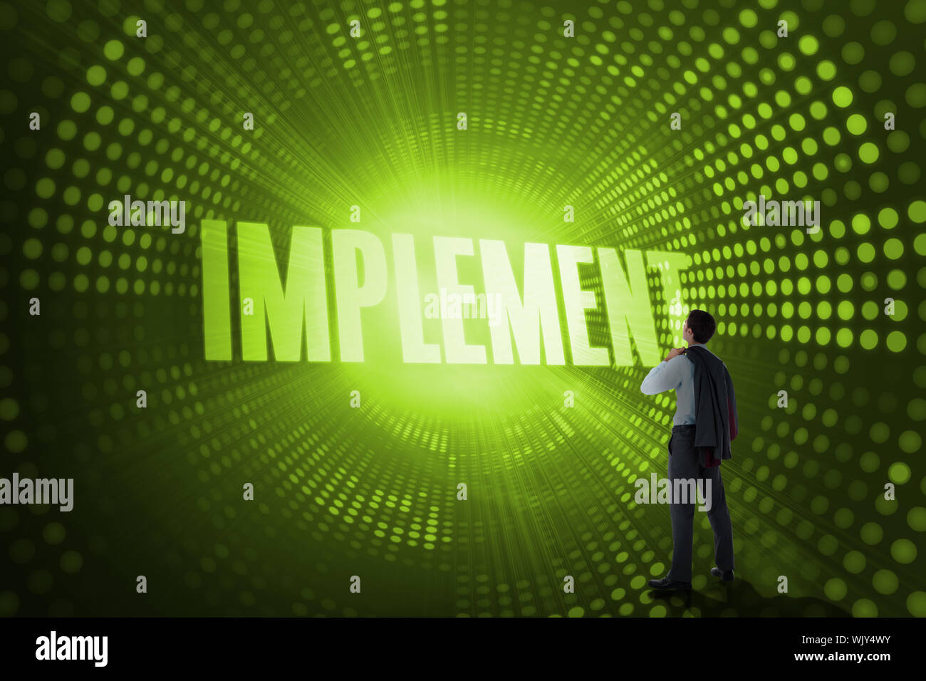 The word implement and businessman holding his jacket against green ... The word implement and businessman holding his jacket against green ...