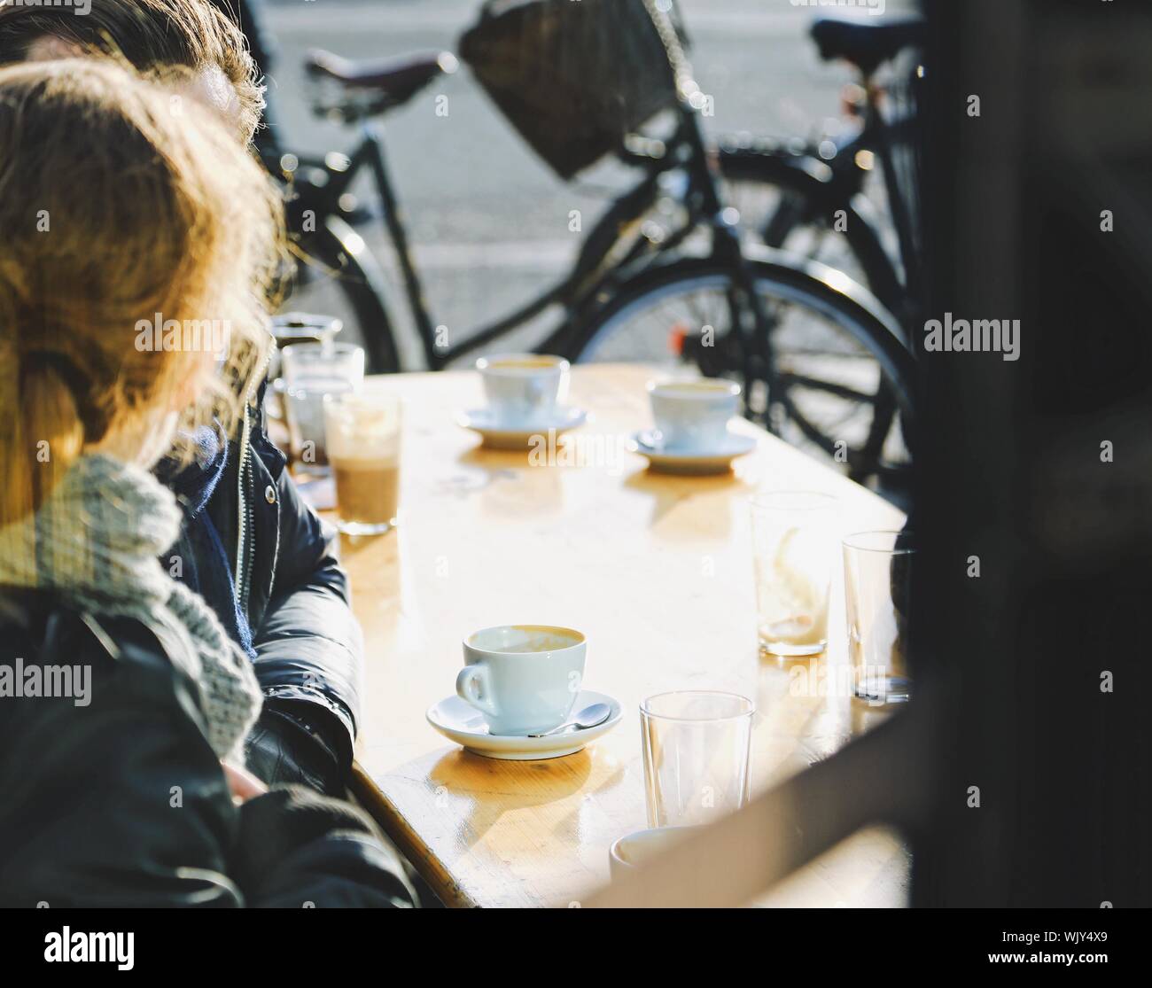 People Sitting At Cafe Stock Photo - Alamy