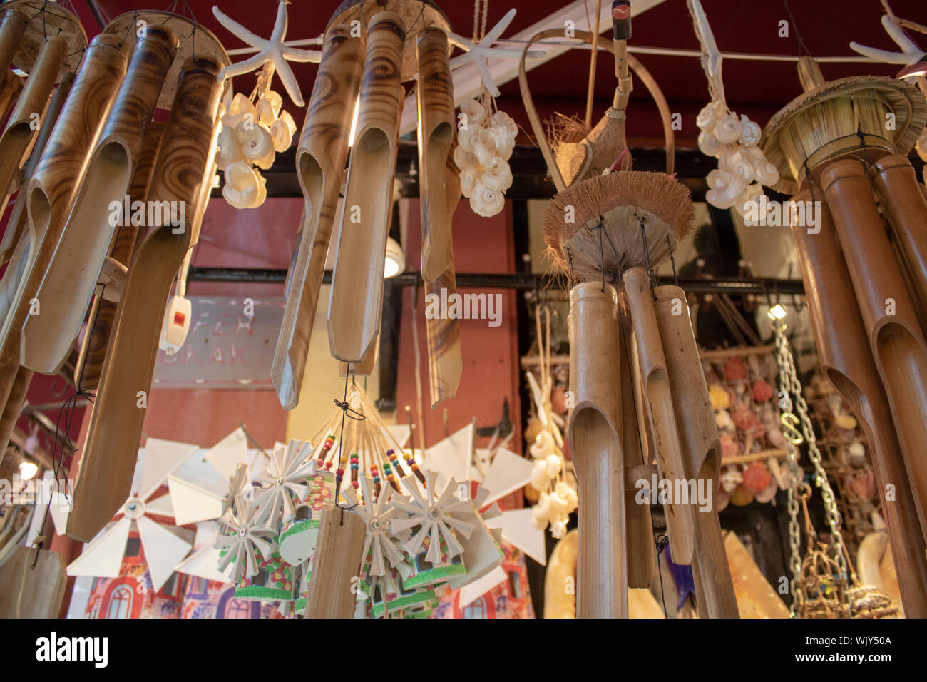 Hanging wooden wind bell. Close-up. Blurred background Stock Photo - Alamy