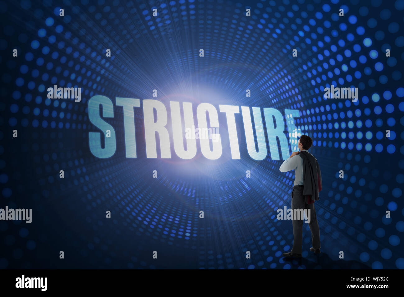 The word structure and businessman holding his jacket against ...