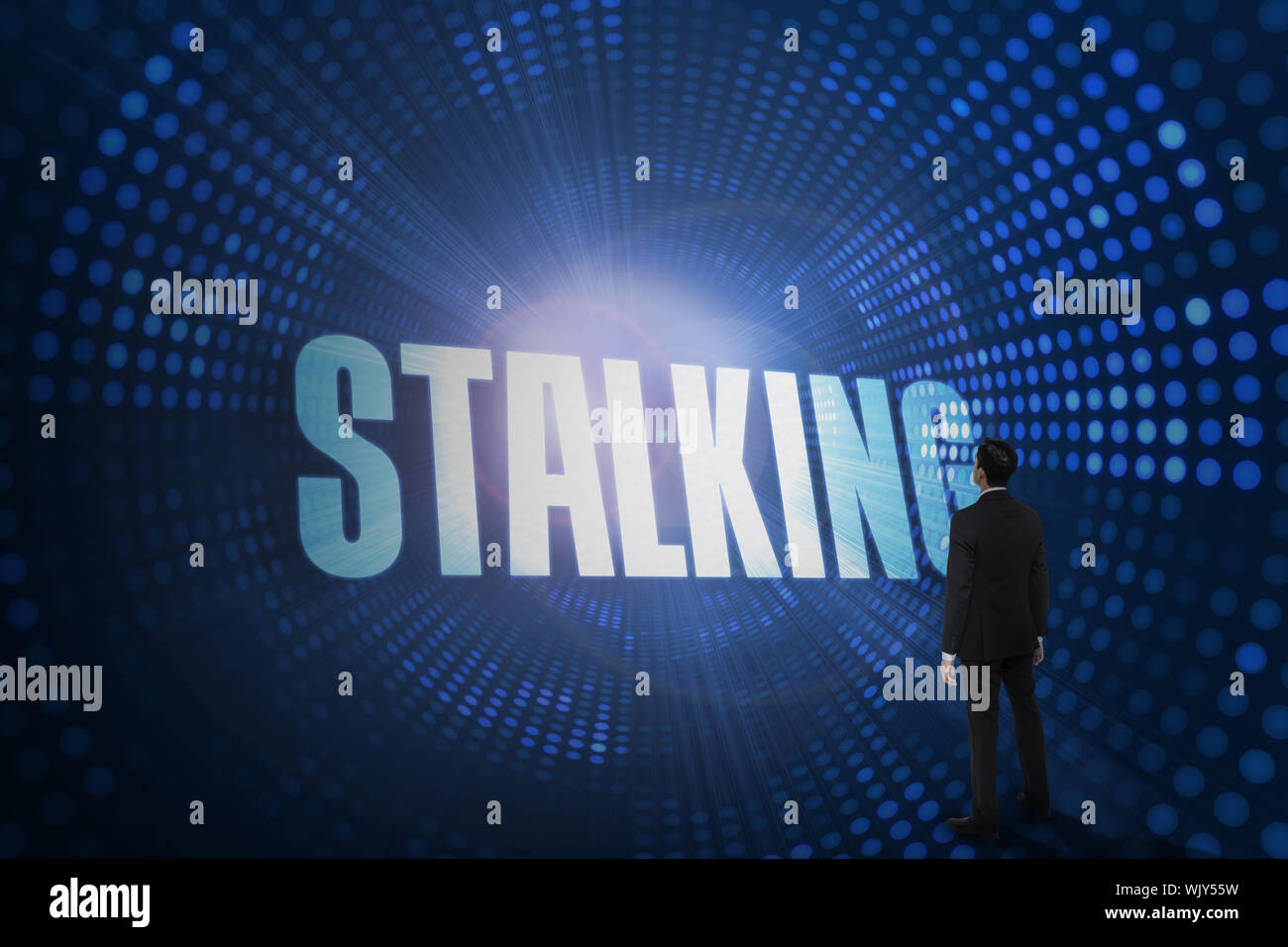 The word stalking and asian businessman against futuristic dotted blue ...