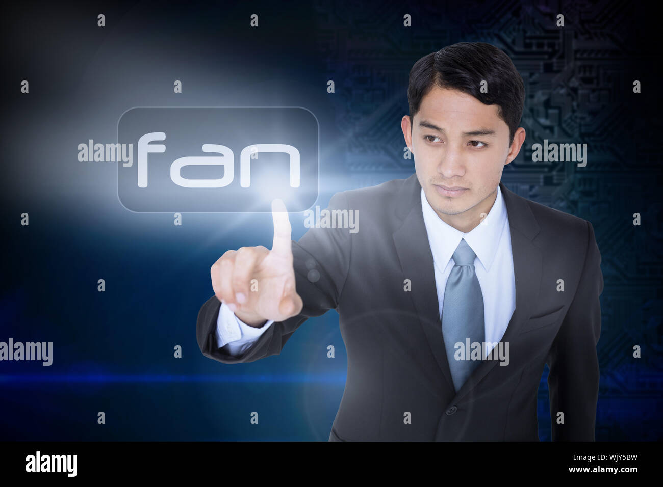 The word fan and unsmiling asian businessman pointing against ...