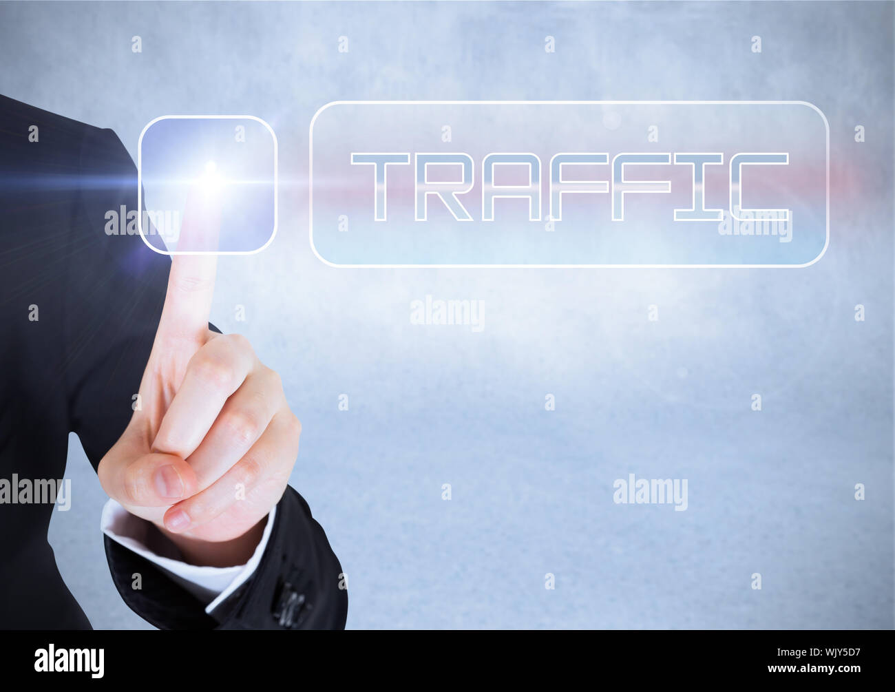 Businesswomans finger touching traffic button against grey wall Stock ...