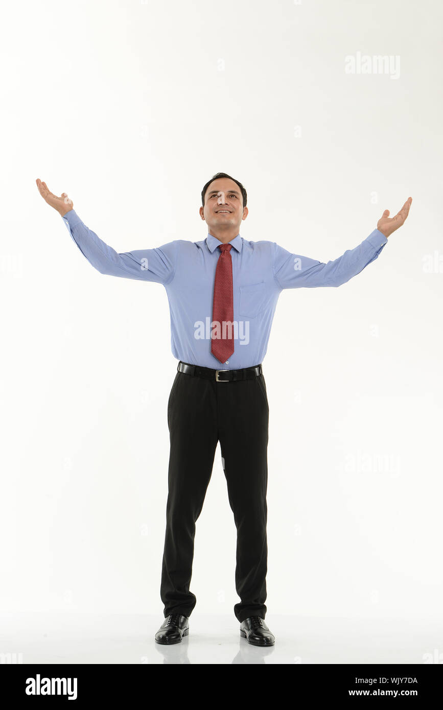 Businessman standing with his arm outstretched Stock Photo - Alamy