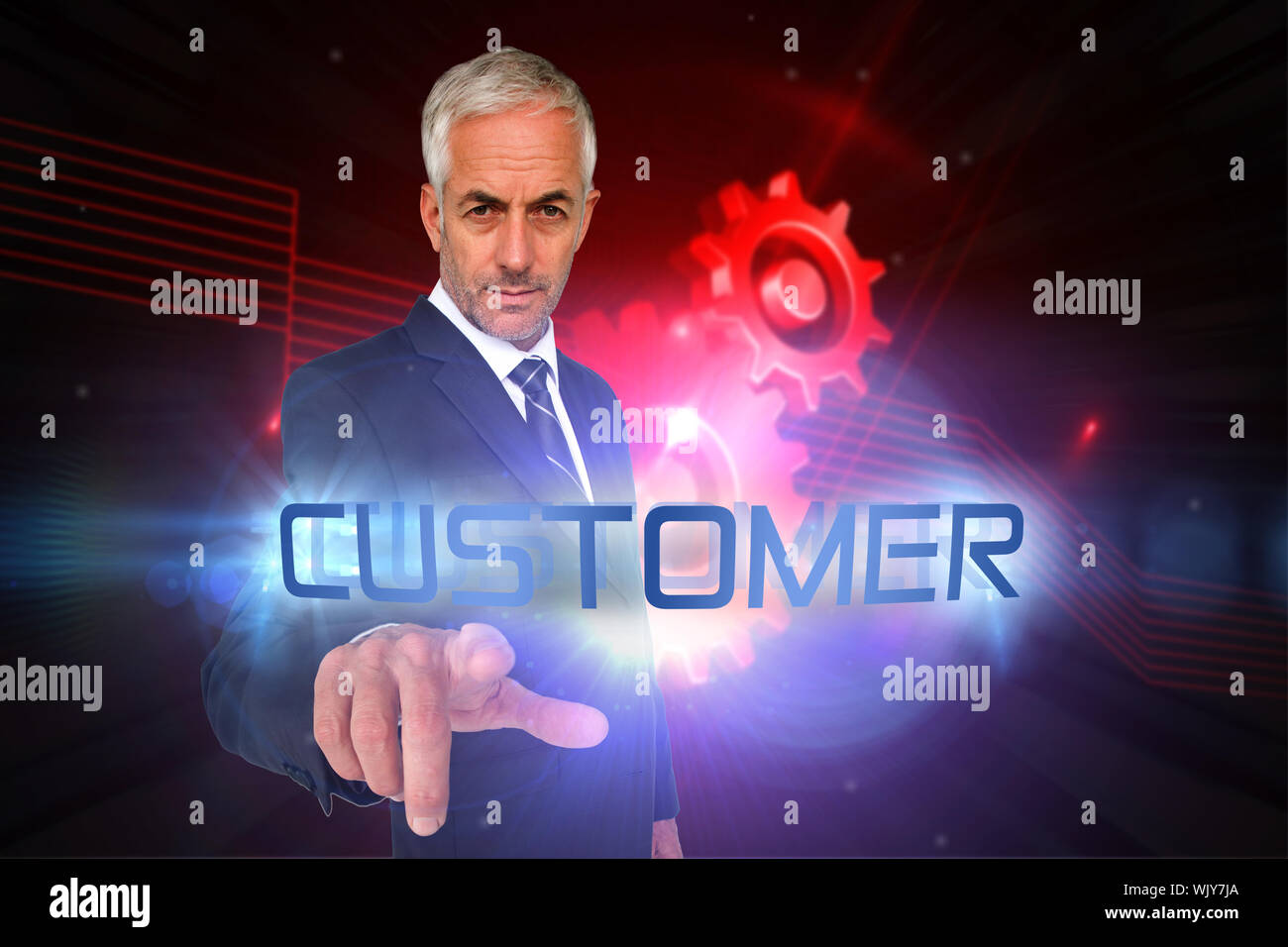 Hand presenting against shiny cogs on blue background Stock Photo - Alamy