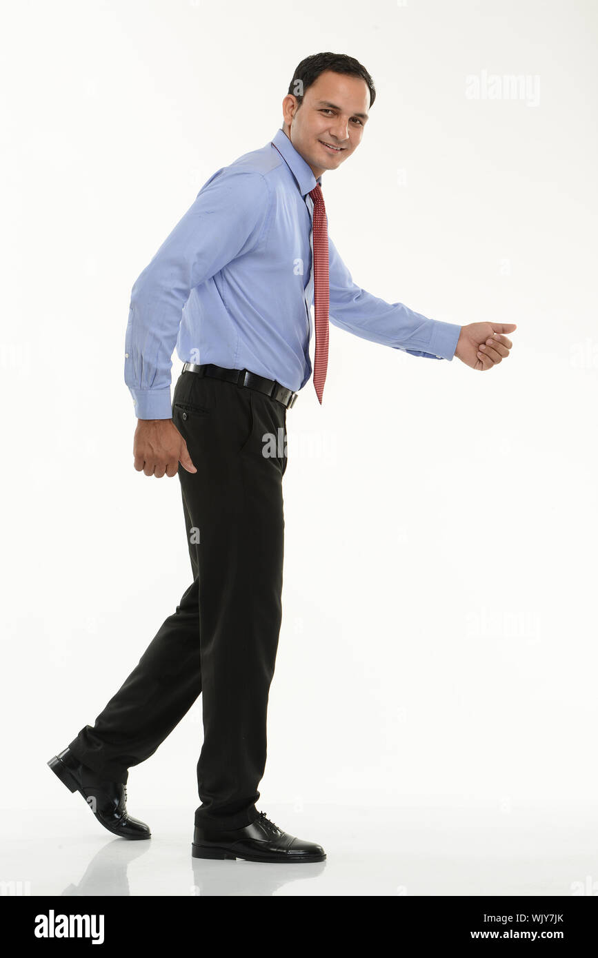 Side profile of a businessman walking Stock Photo - Alamy