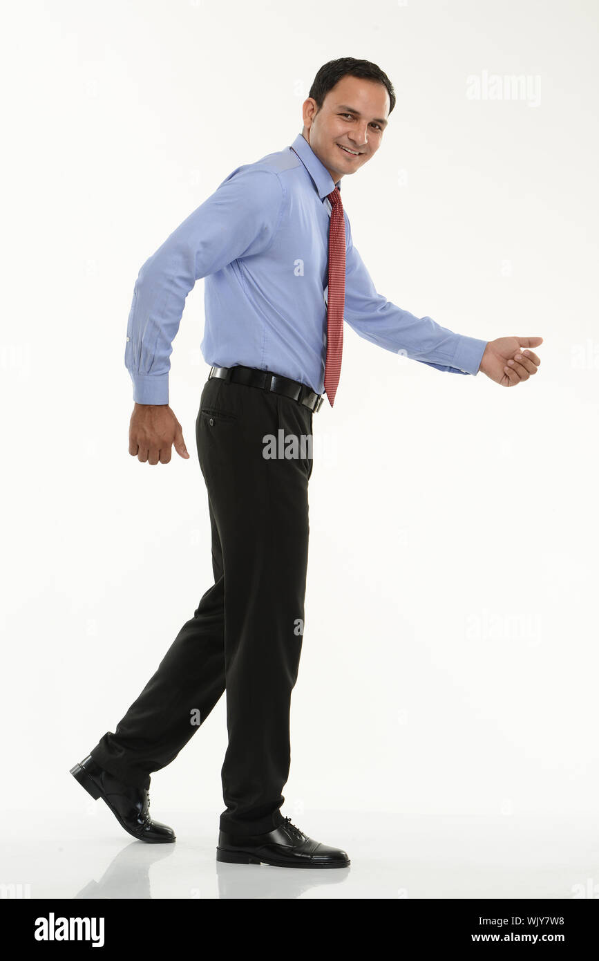 Side profile of a businessman walking Stock Photo - Alamy