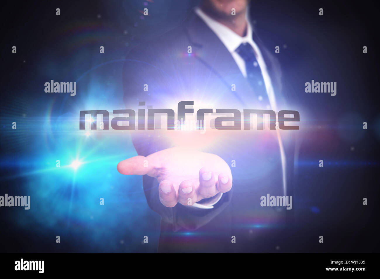 The word mainframe and businessman presenting against black background ...