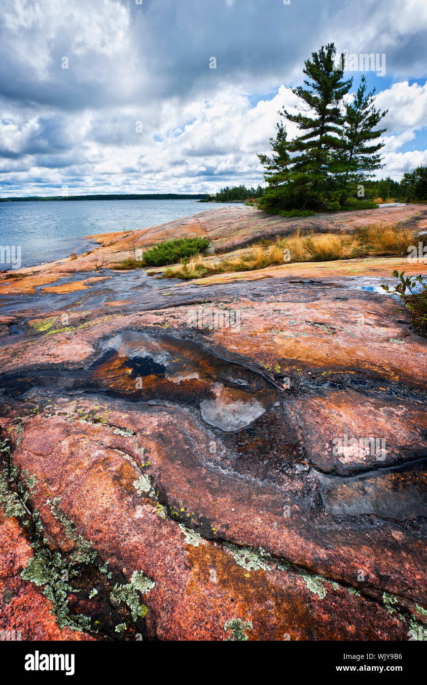 Rocky lake shore of Georgian Bay in Killbear provincial park near Parry ...