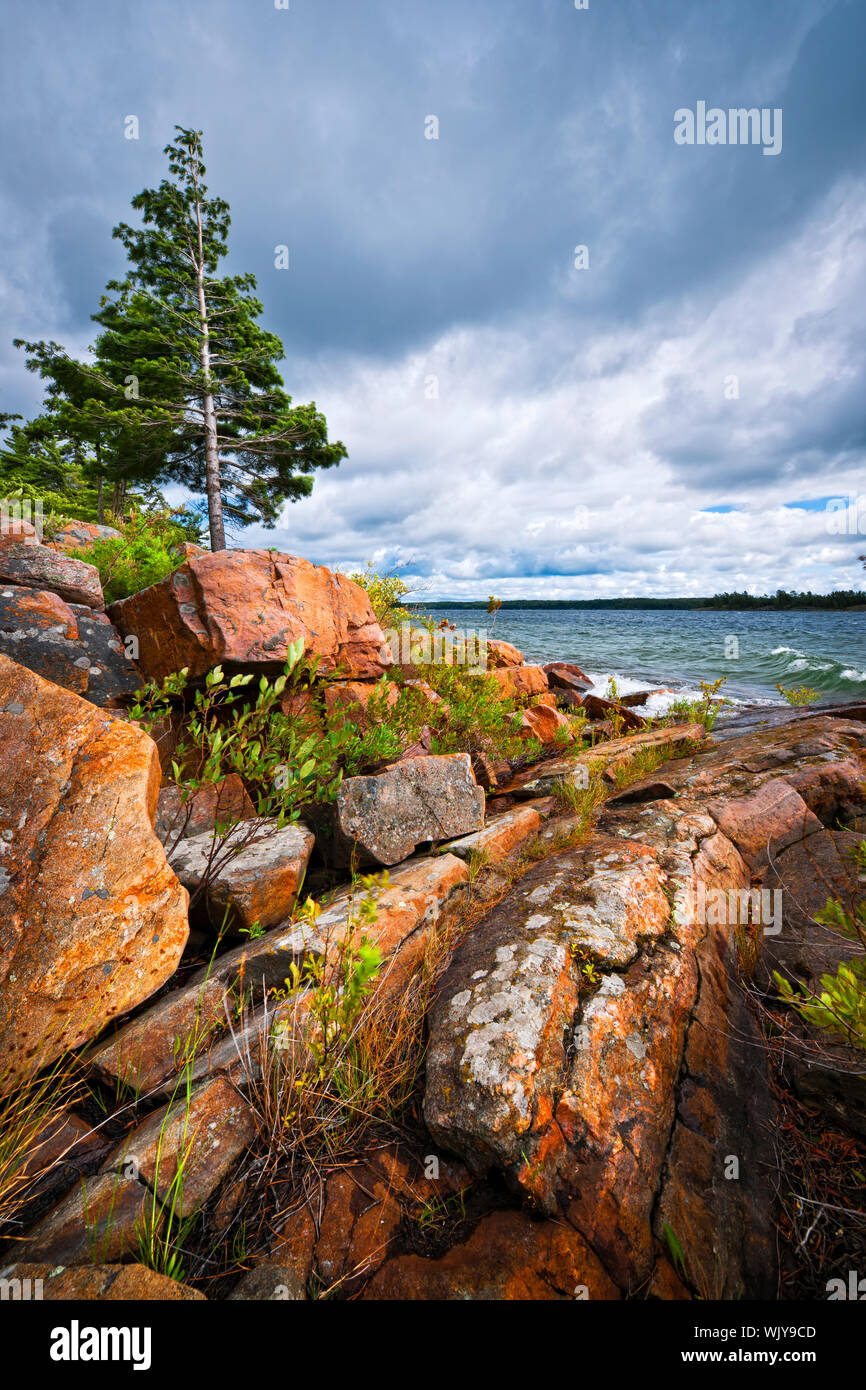 Rocky lake shore of Georgian Bay in Killbear provincial park near Parry ...