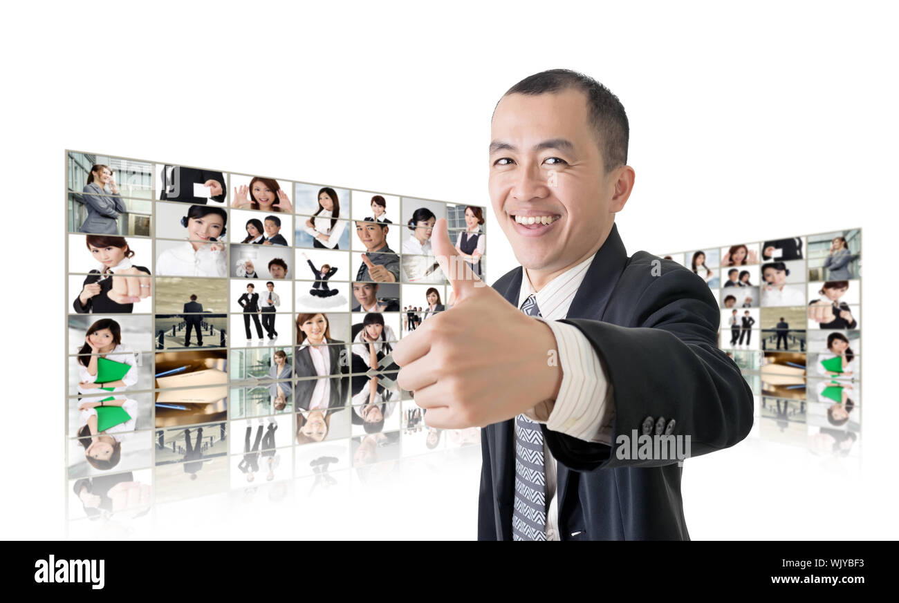 Asian business man or boss standing in front of tV screen wall showing ...