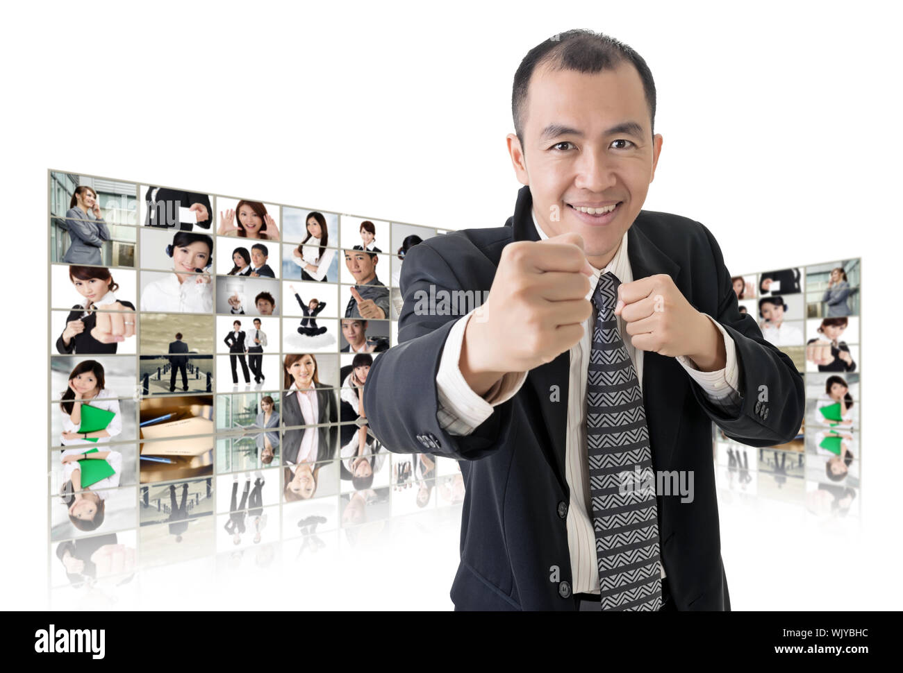 Asian business man or boss standing in front of tV screen wall showing ...