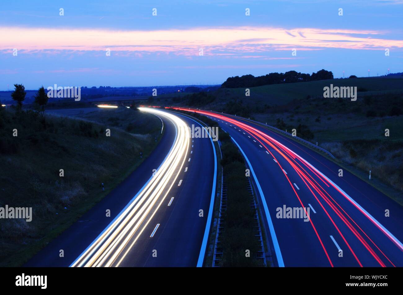 night time traffic on highway with lights showing transportation ...