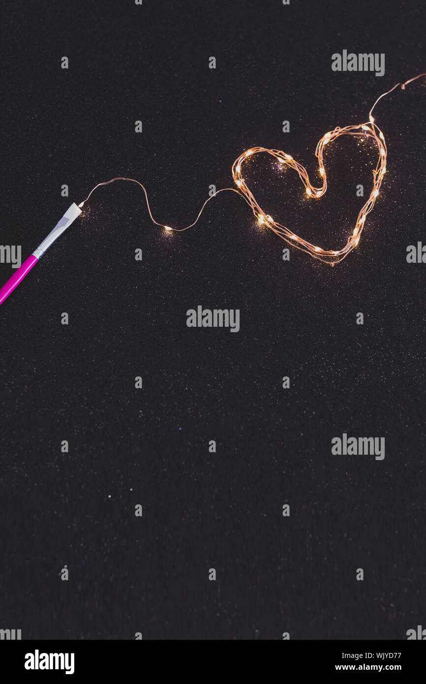 paintbrush painting with light with a set of string led lights, surreal ...