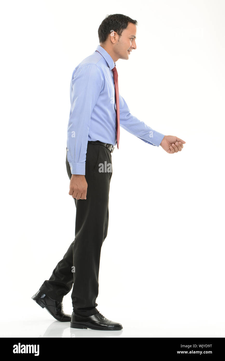 Side profile of a businessman walking Stock Photo - Alamy