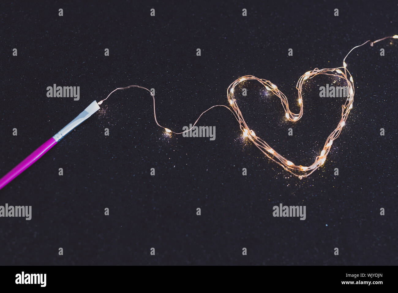 paintbrush painting with light with a set of string led lights, surreal ...