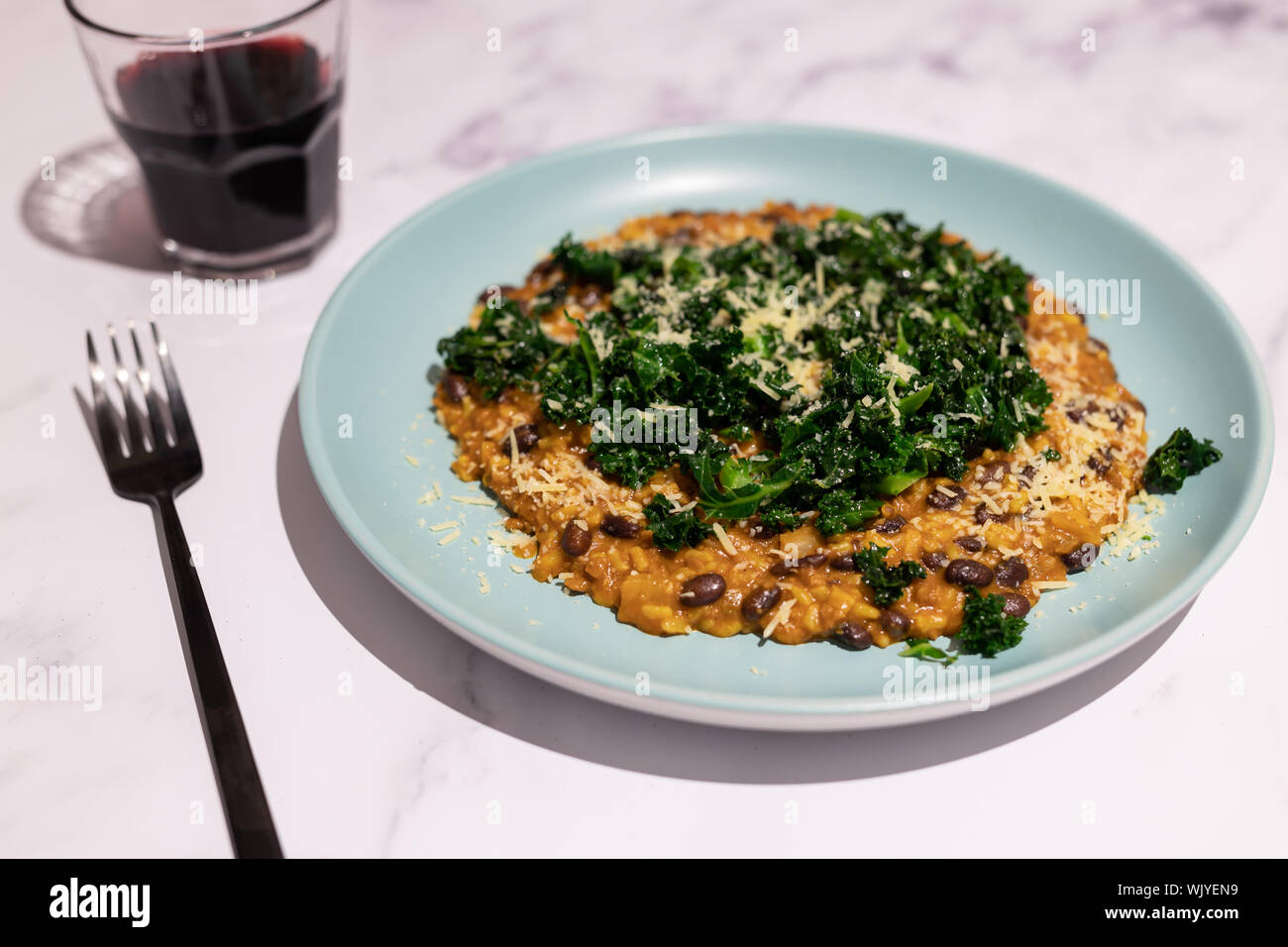 vegetarian black beans risotto with charred kale and vegan cheese ...