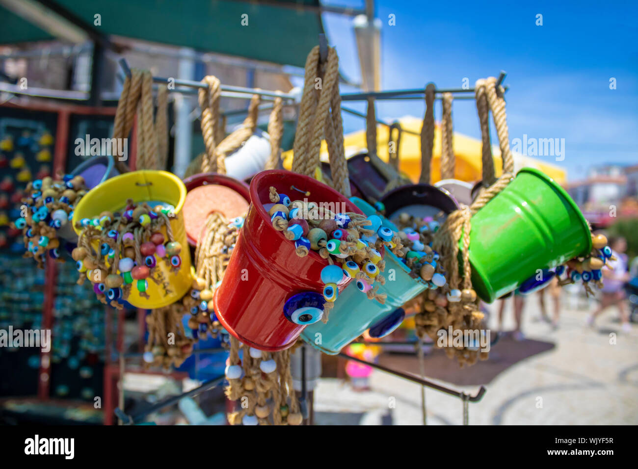 Decorative colorful small buckets sold in the store. Yellow color ...
