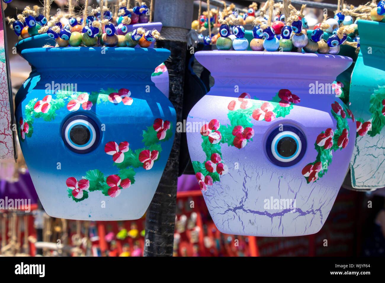 Decorative colorful small buckets sold in the store. Yellow color ...