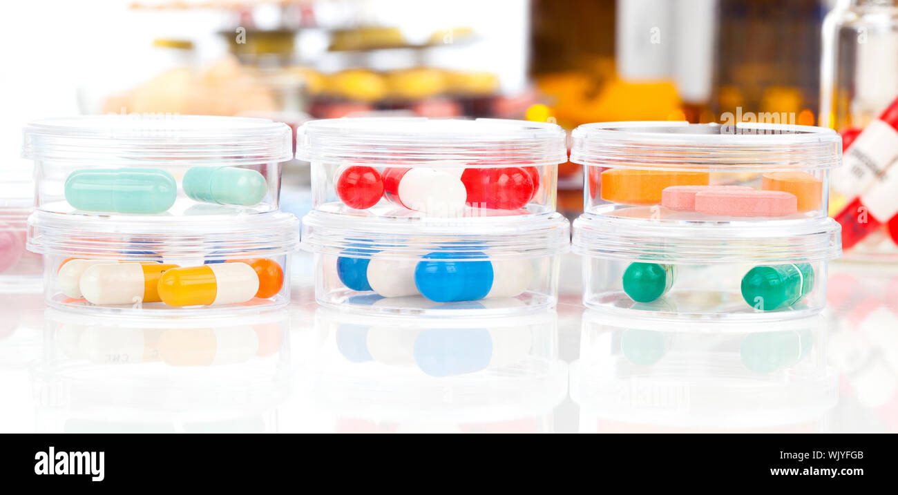 Colorful medical capsules in Petri dishes. Laboratory concept Stock ...