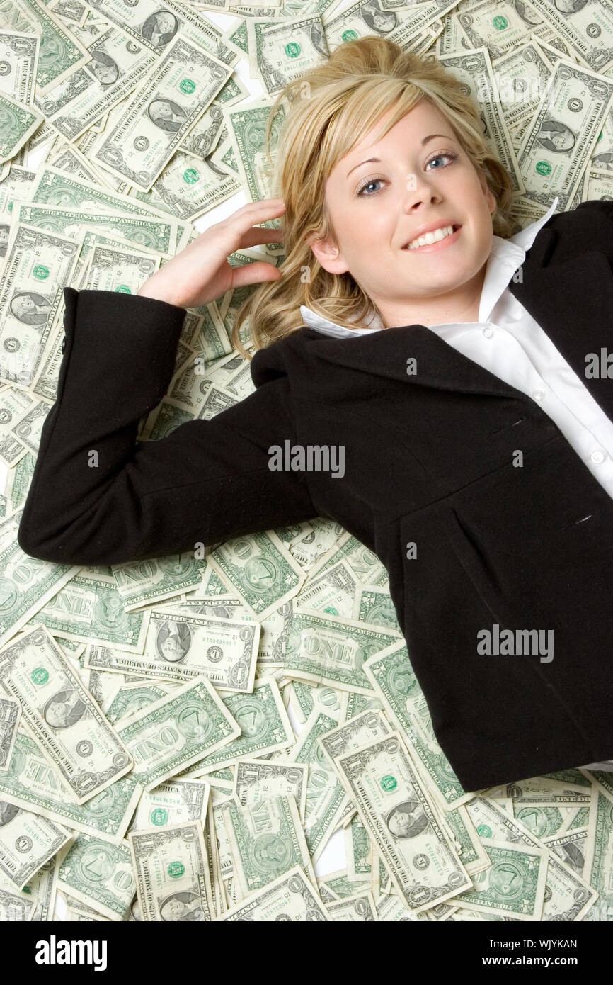 Woman laying down money hi-res stock photography and images - Alamy
