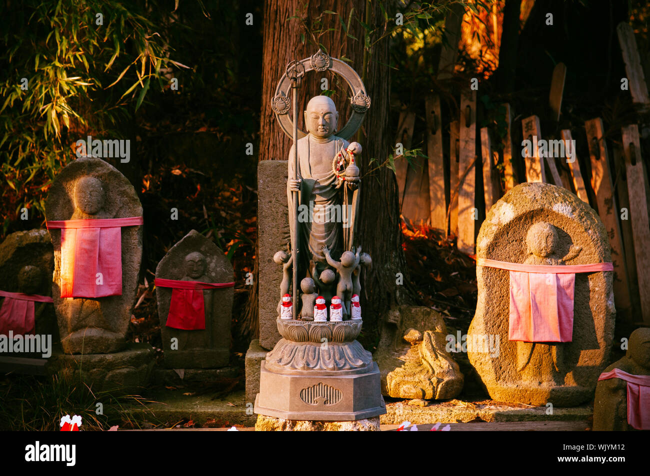 Jizo Bosatsu stone monk statues with bib and hat at Yamadera temple ...