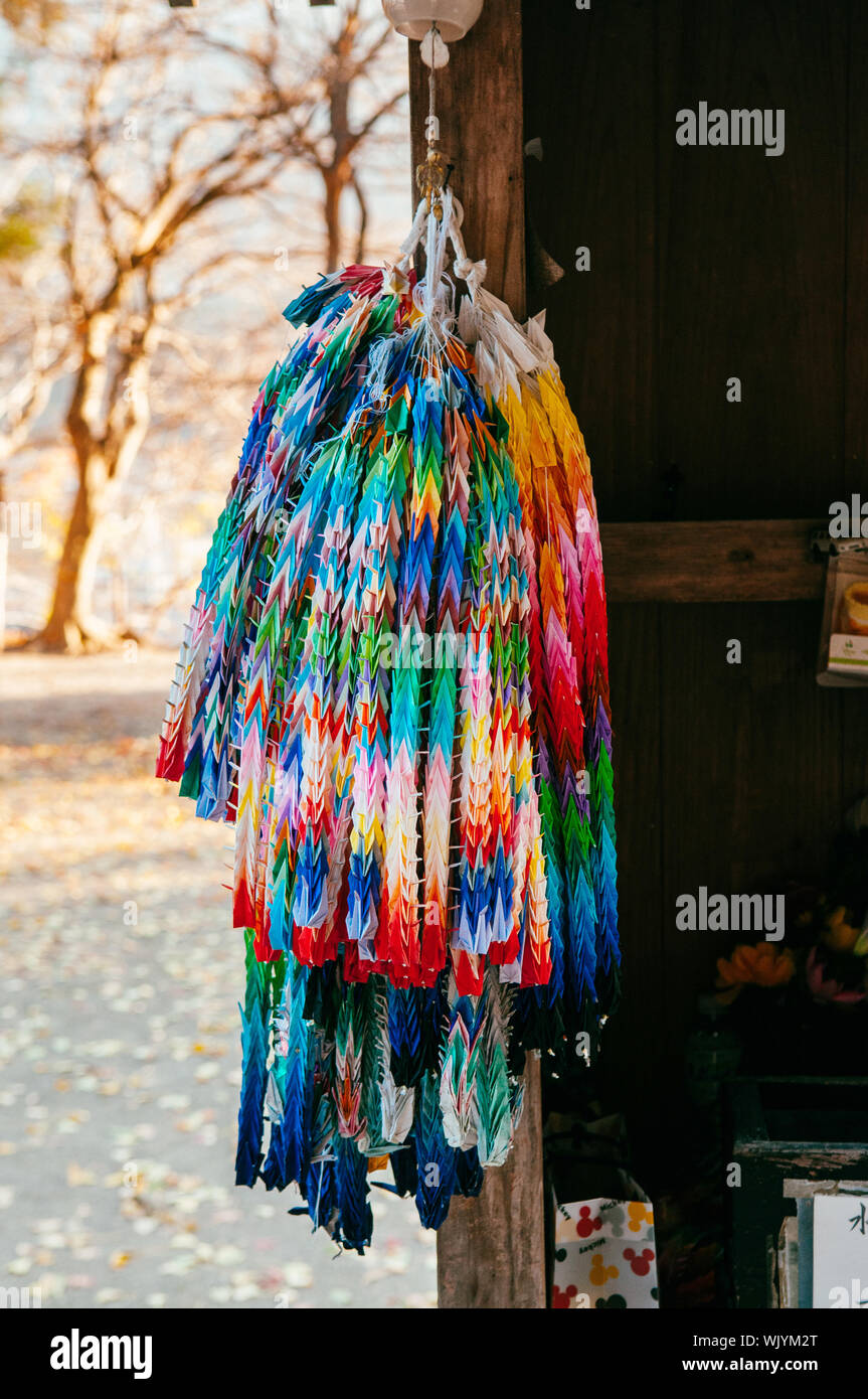 Colourful paper crane birds Origami paper hanging at Buddhist temple or ...
