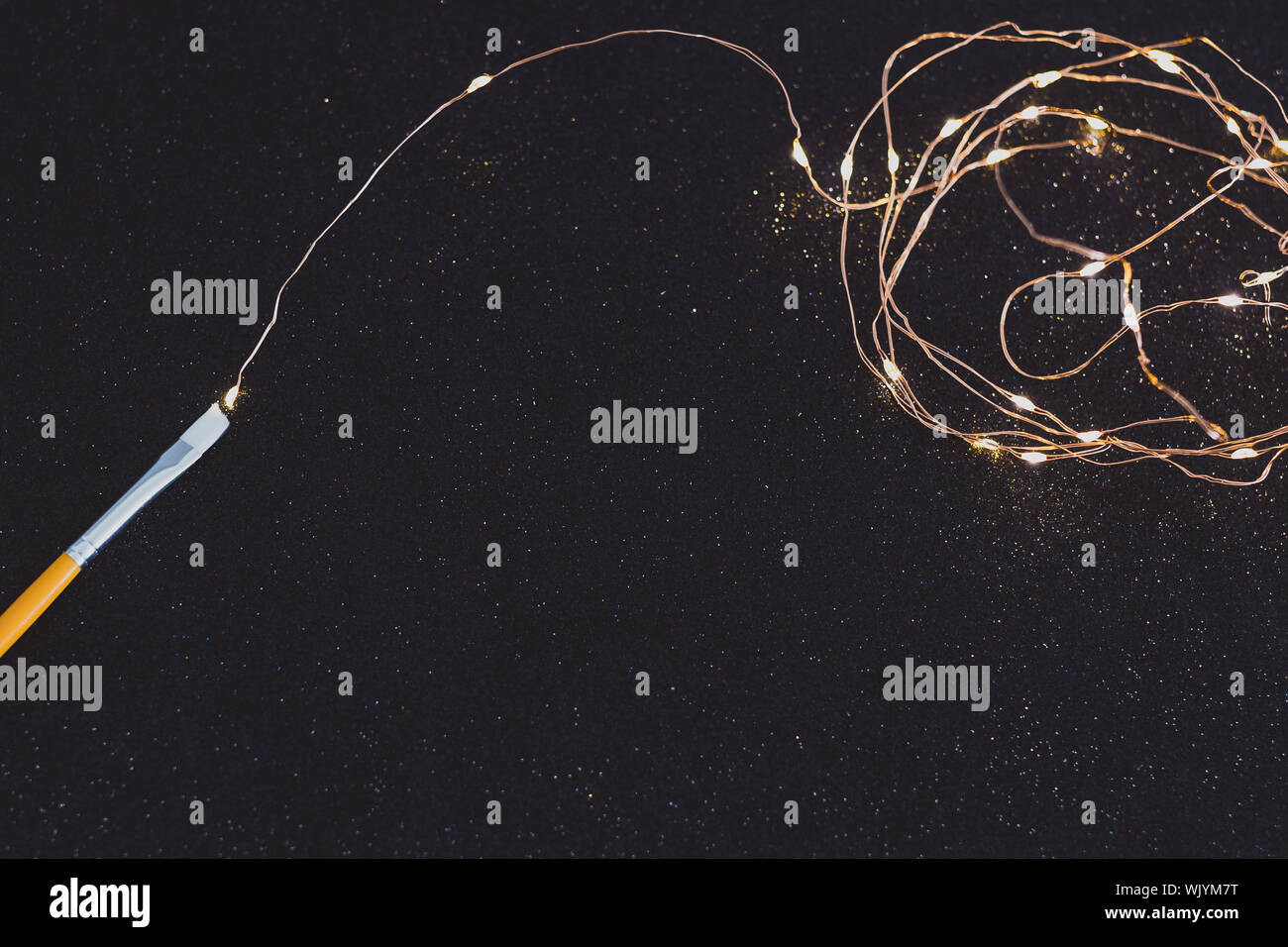 paintbrush painting with light with a set of string led lights, surreal ...