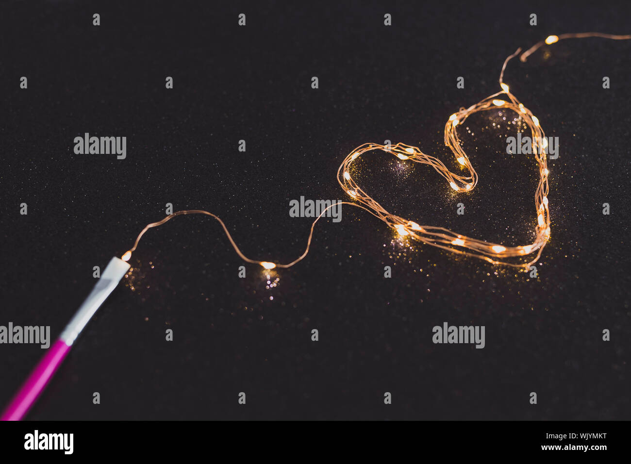 paintbrush painting with light with a set of string led lights, surreal ...