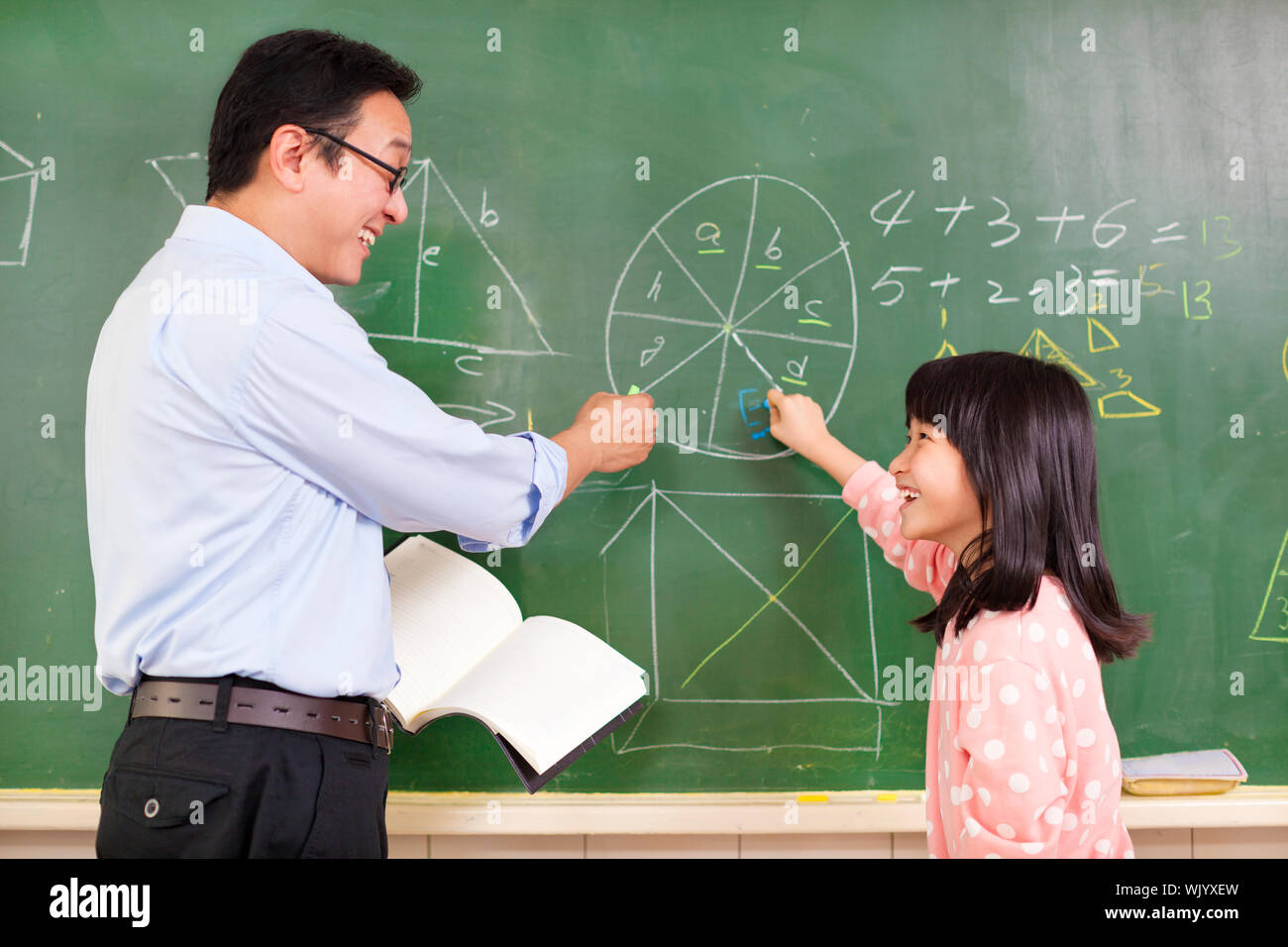 Teacher and student discussing math questions Stock Photo - Alamy