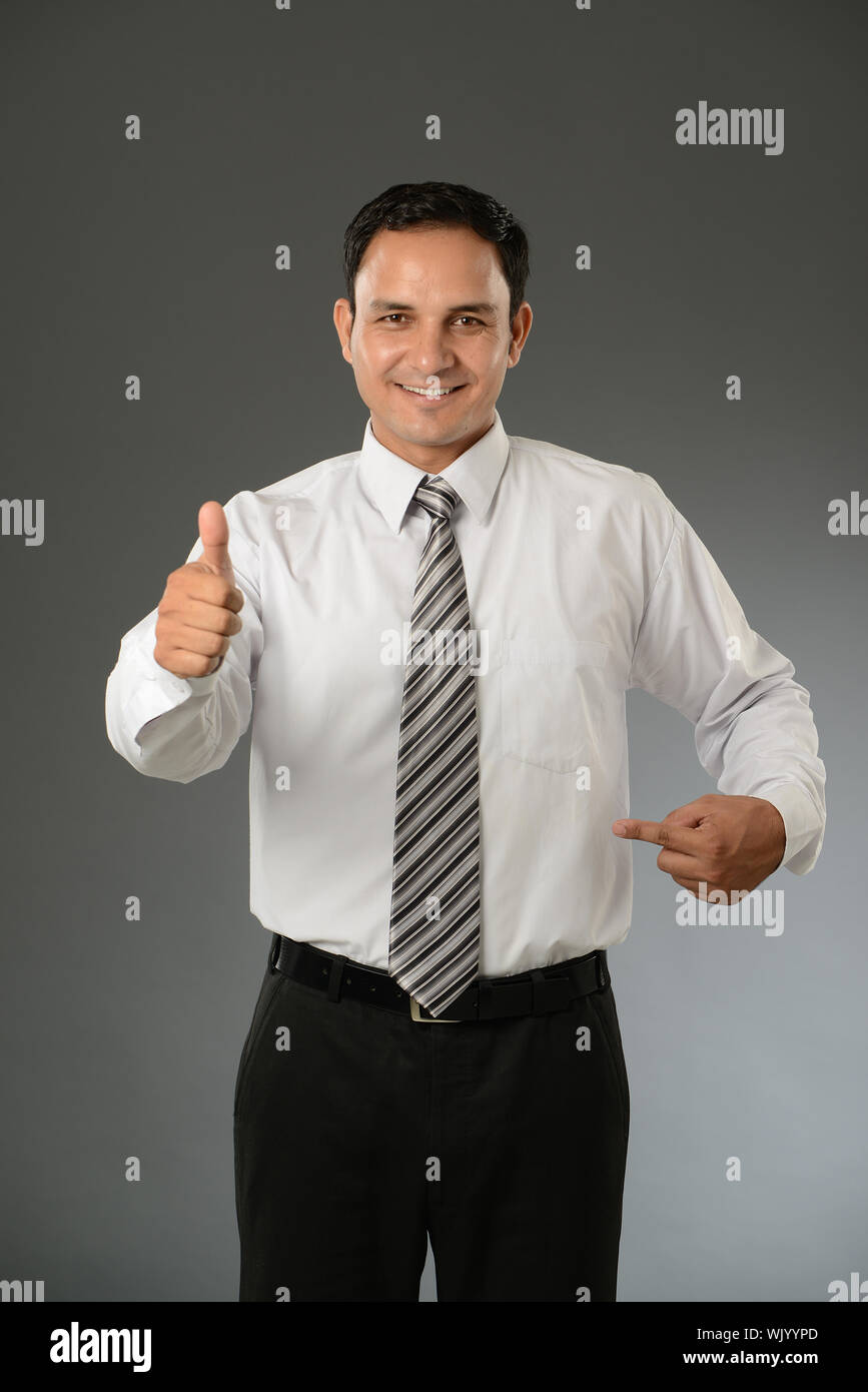 Man pointing gesturing thumbs up hi-res stock photography and images ...