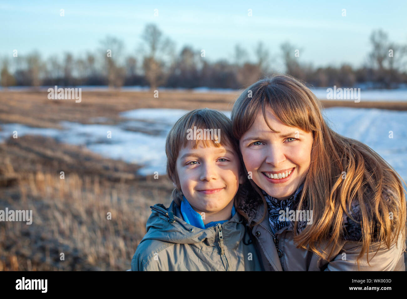 Happy mother and son laughing together outdoors Stock Photo - Alamy