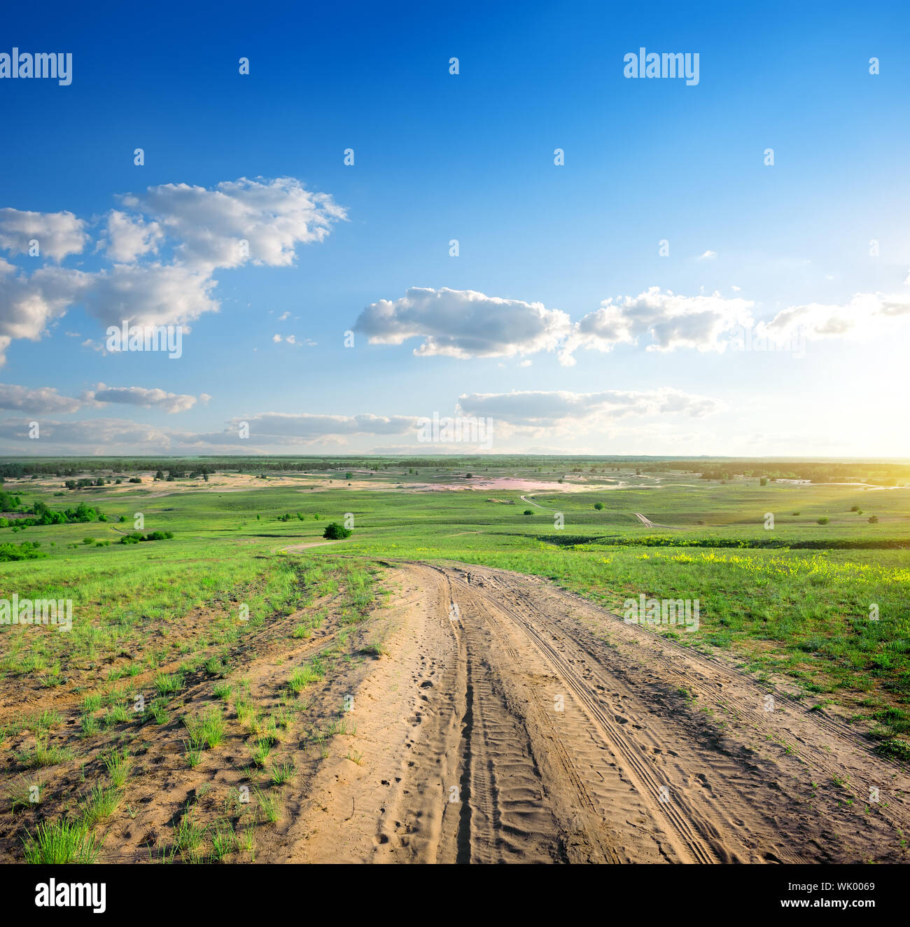 Beautiful morning sun over the country road Stock Photo - Alamy