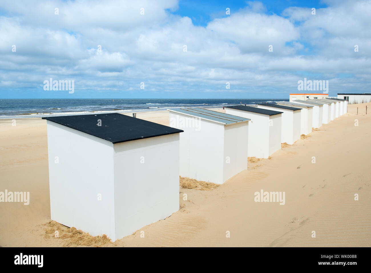Row blue and white beach cabins for vacation surpose Stock Photo - Alamy