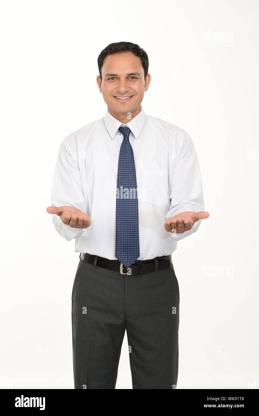 Businessman standing with his arm outstretched Stock Photo - Alamy