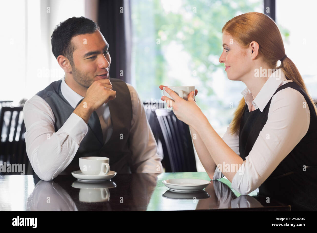 Business people talking over coffee Stock Photo - Alamy
