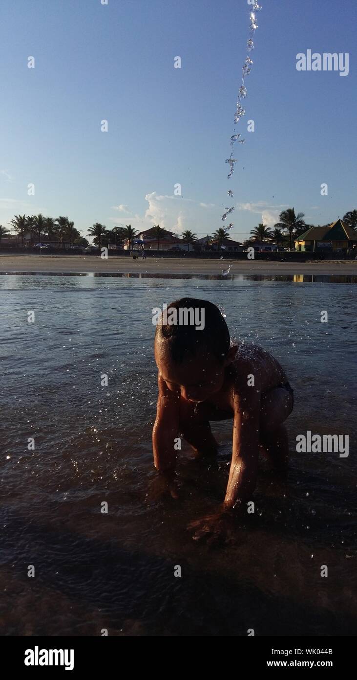 Baby playing in water hi-res stock photography and images - Alamy