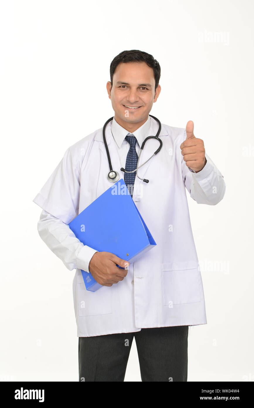 Male doctor standing with medical report and showing thumbs up sign ...