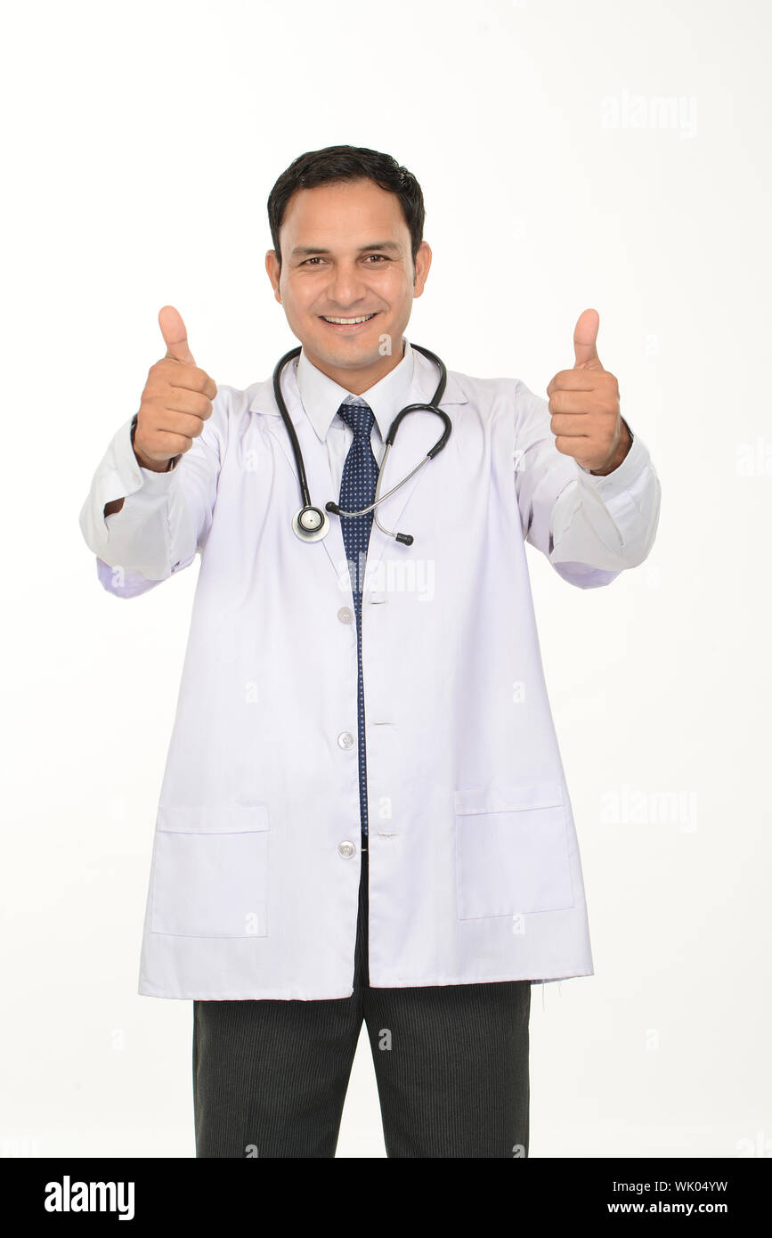 Male doctor showing thumbs up sign with both hands and smiling Stock ...