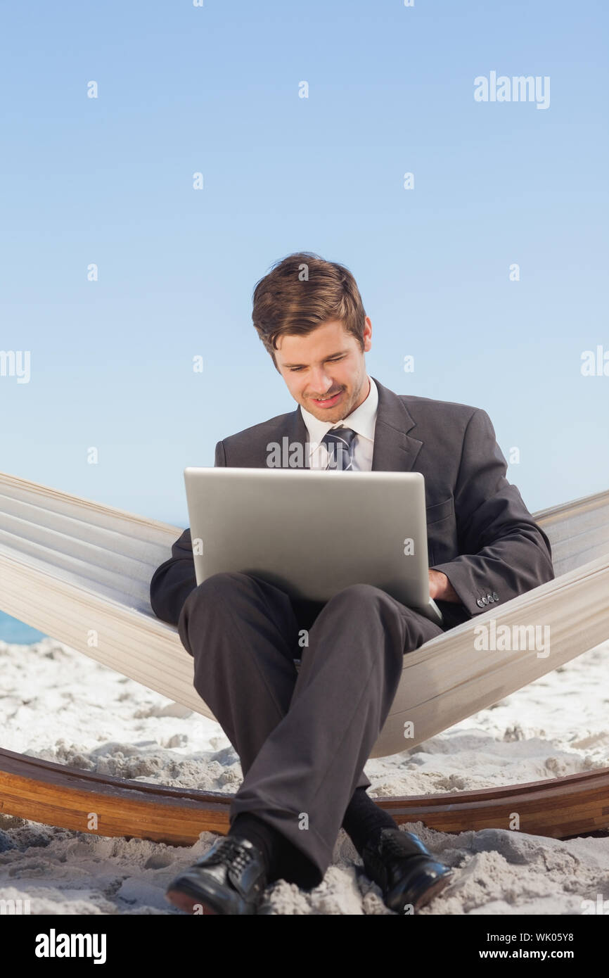 Adult male smiling typing hi-res stock photography and images - Alamy